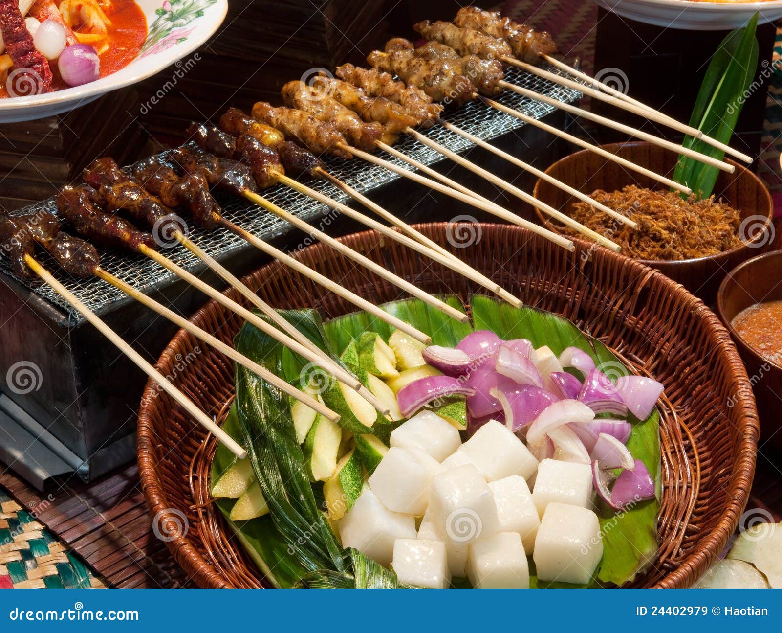 Satay and condiments stock image. Image of dining, dish - 24402979