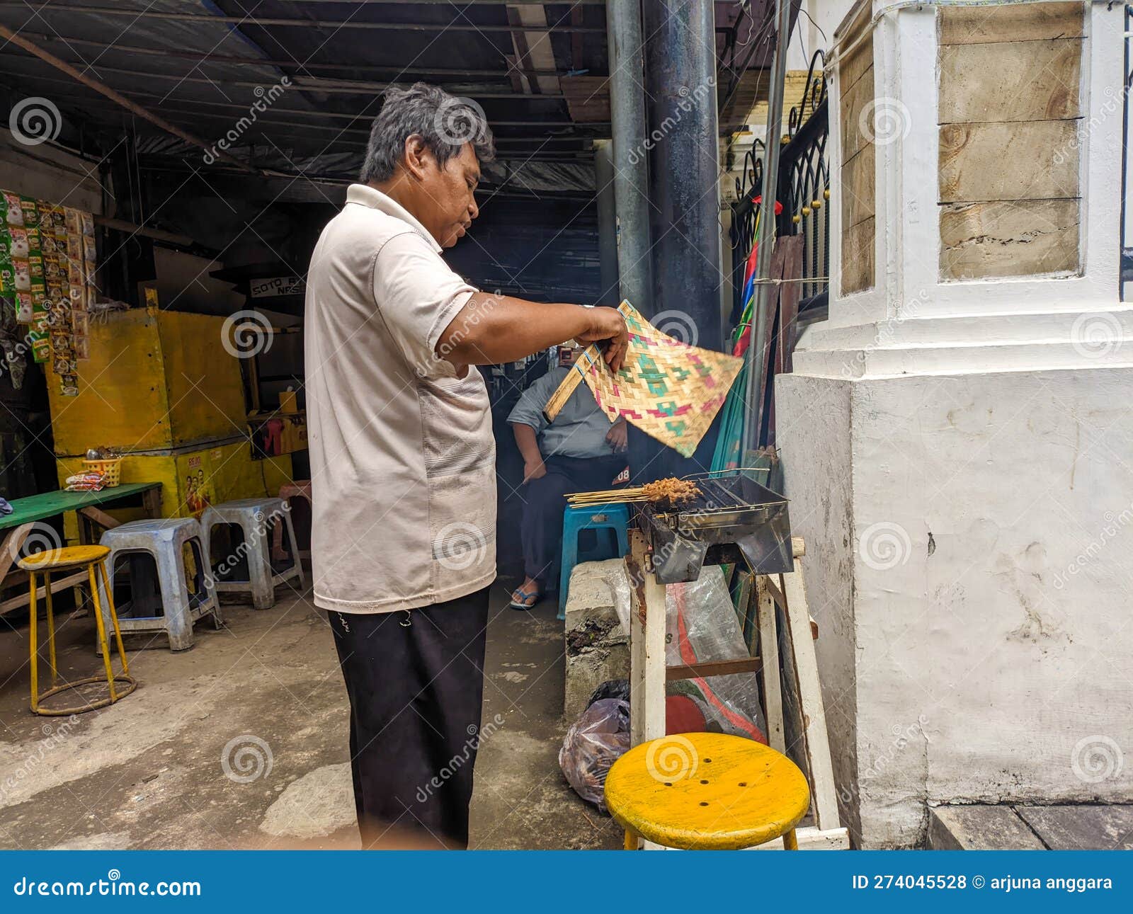 A Satay Seller Roasting Satay or Sate Over a Fire Editorial Stock Photo ...