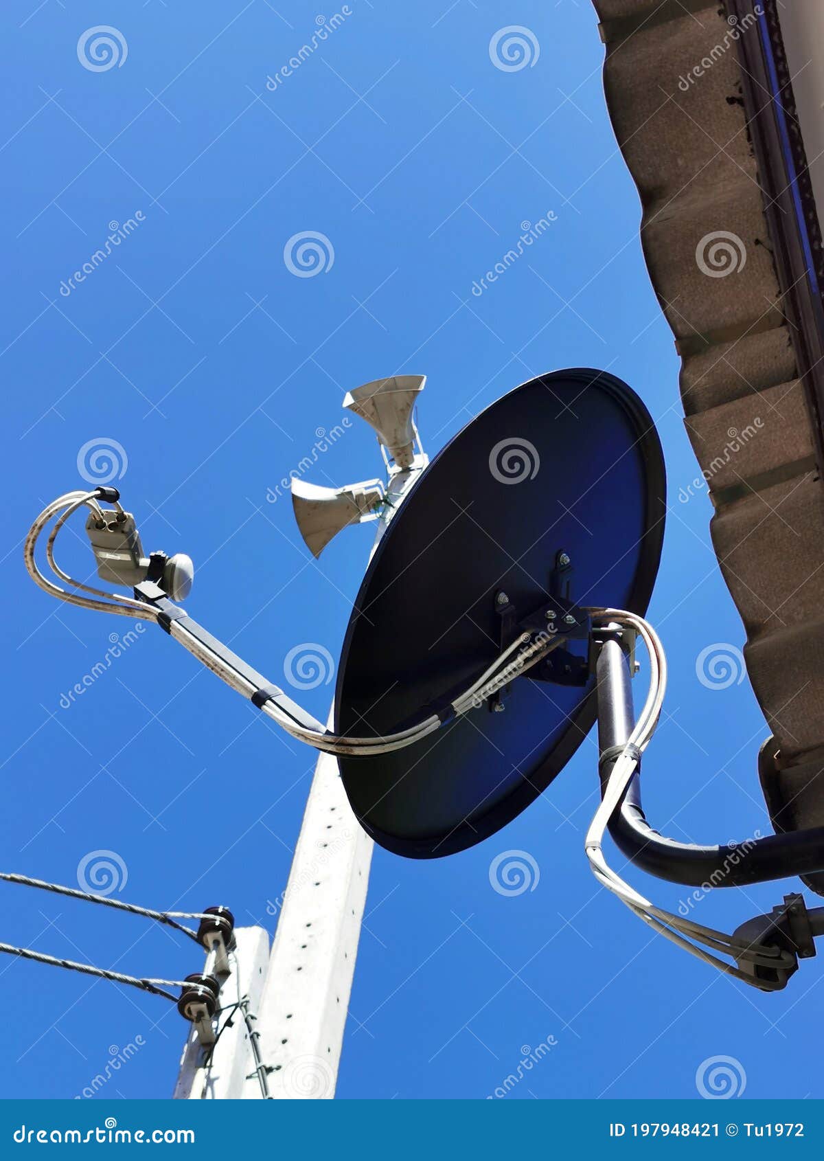 Satellite In The Blue Sky, On The Roof Of A House With The Eletrical ...