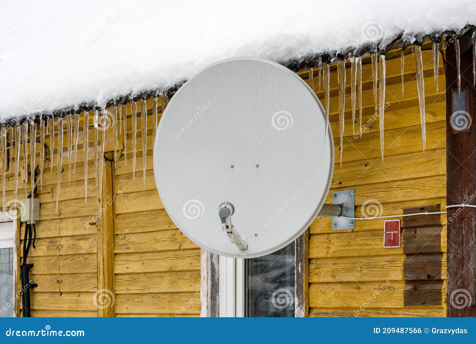 Satellite Dish is Fixed on the Wall of an Ancient Wooden House Stock ...