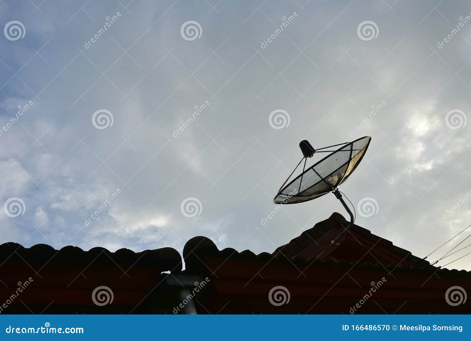 A Satellite Dish on the Roof Stock Photo - Image of tiled, twilight ...