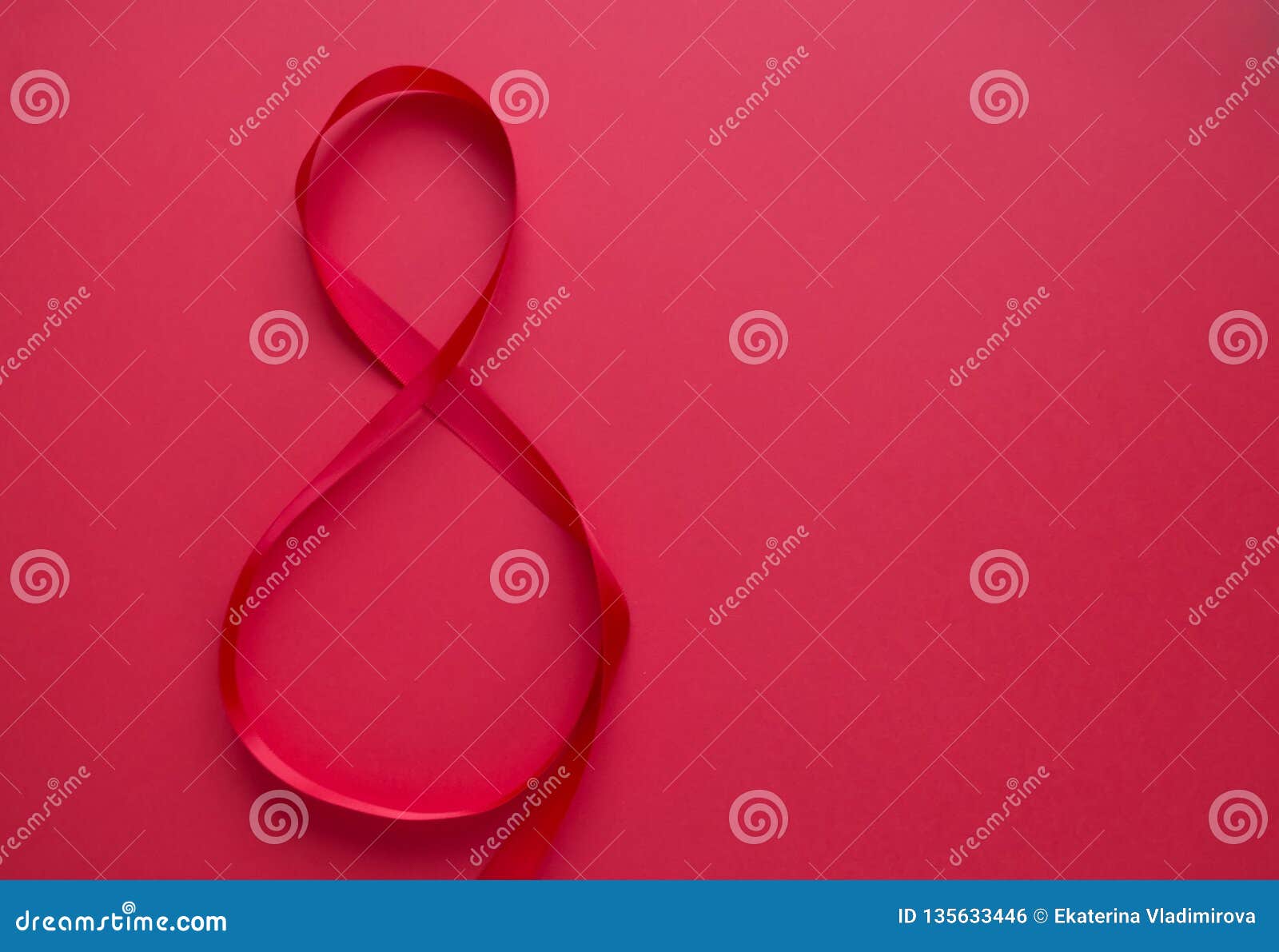 Satin Red Ribbon in the Form of 8 on a Red Background Stock Photo ...