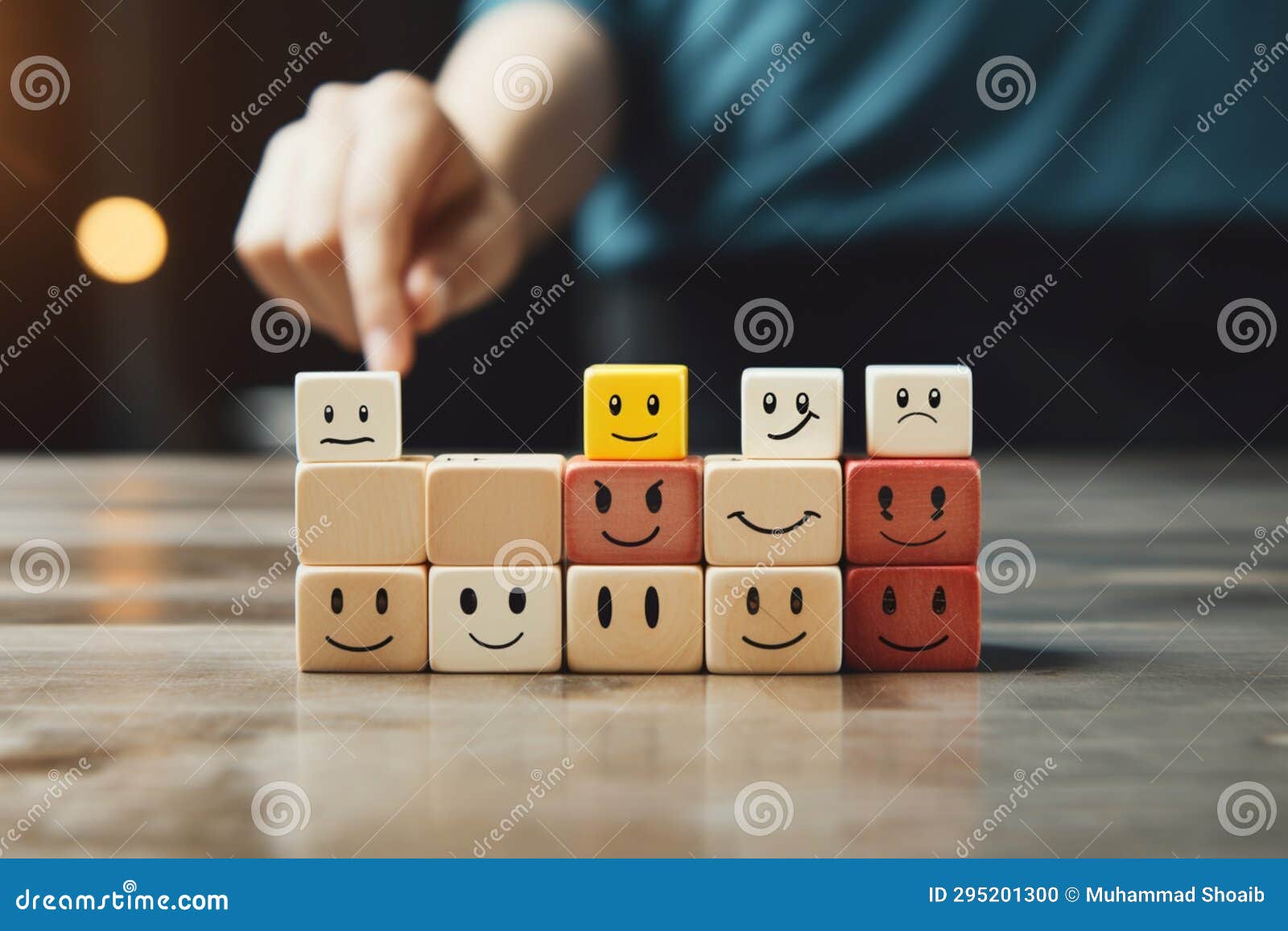 Satisfaction Choice Hand Selects a Smiley Face Over Blurred Sad Faces ...