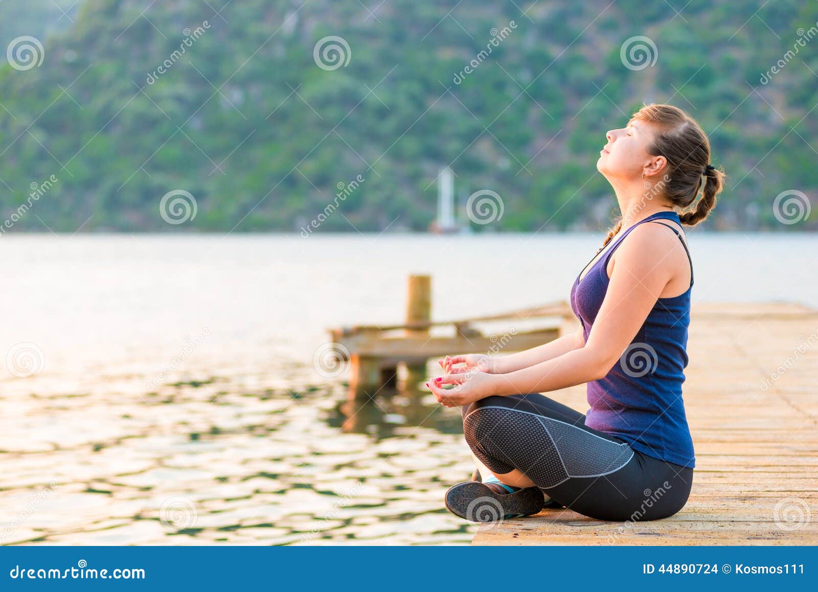 Satisfied Athlete Relaxes on a Pier Stock Photo - Image of position ...