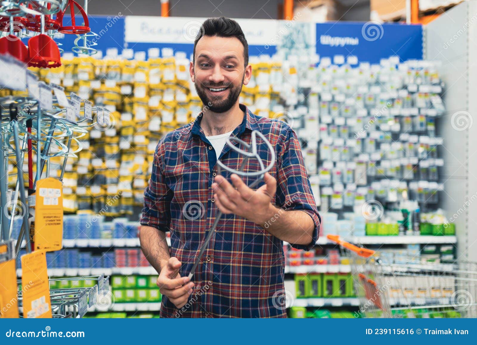 Satisfied Customer in a Hardware Store with a Mixer Attachment in His ...