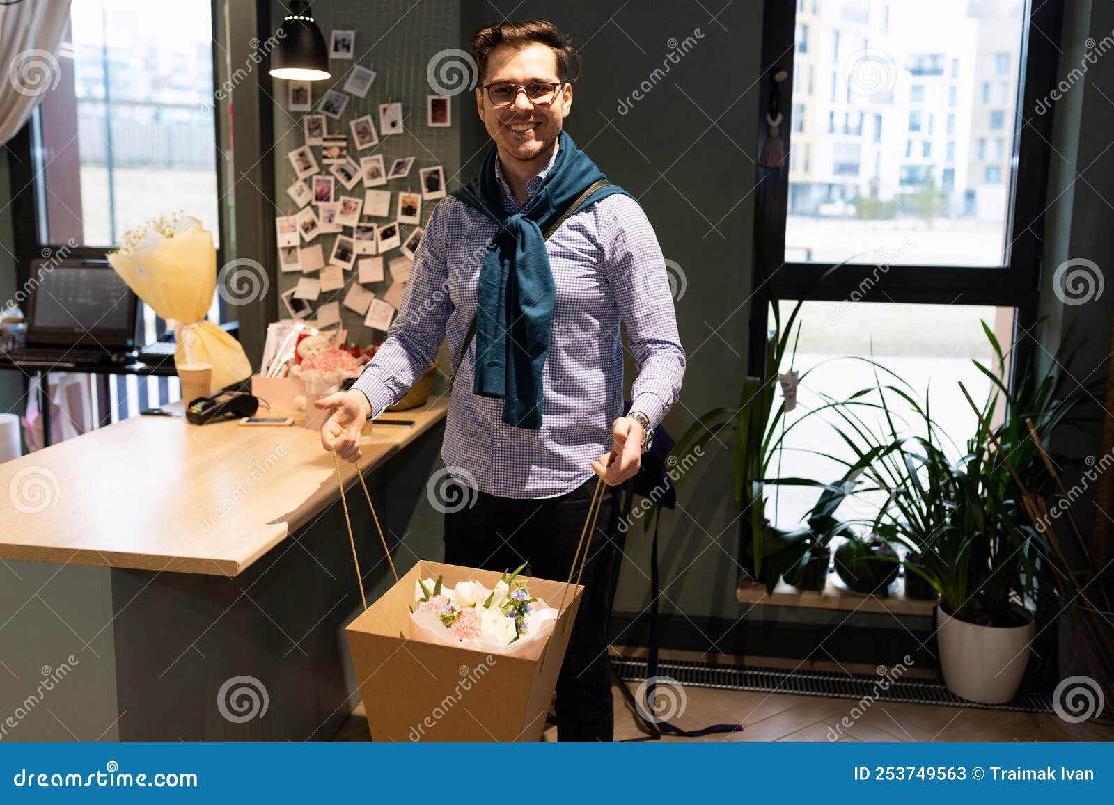 Satisfied Customer with a Packed Bouquet of Flowers Looking at the ...
