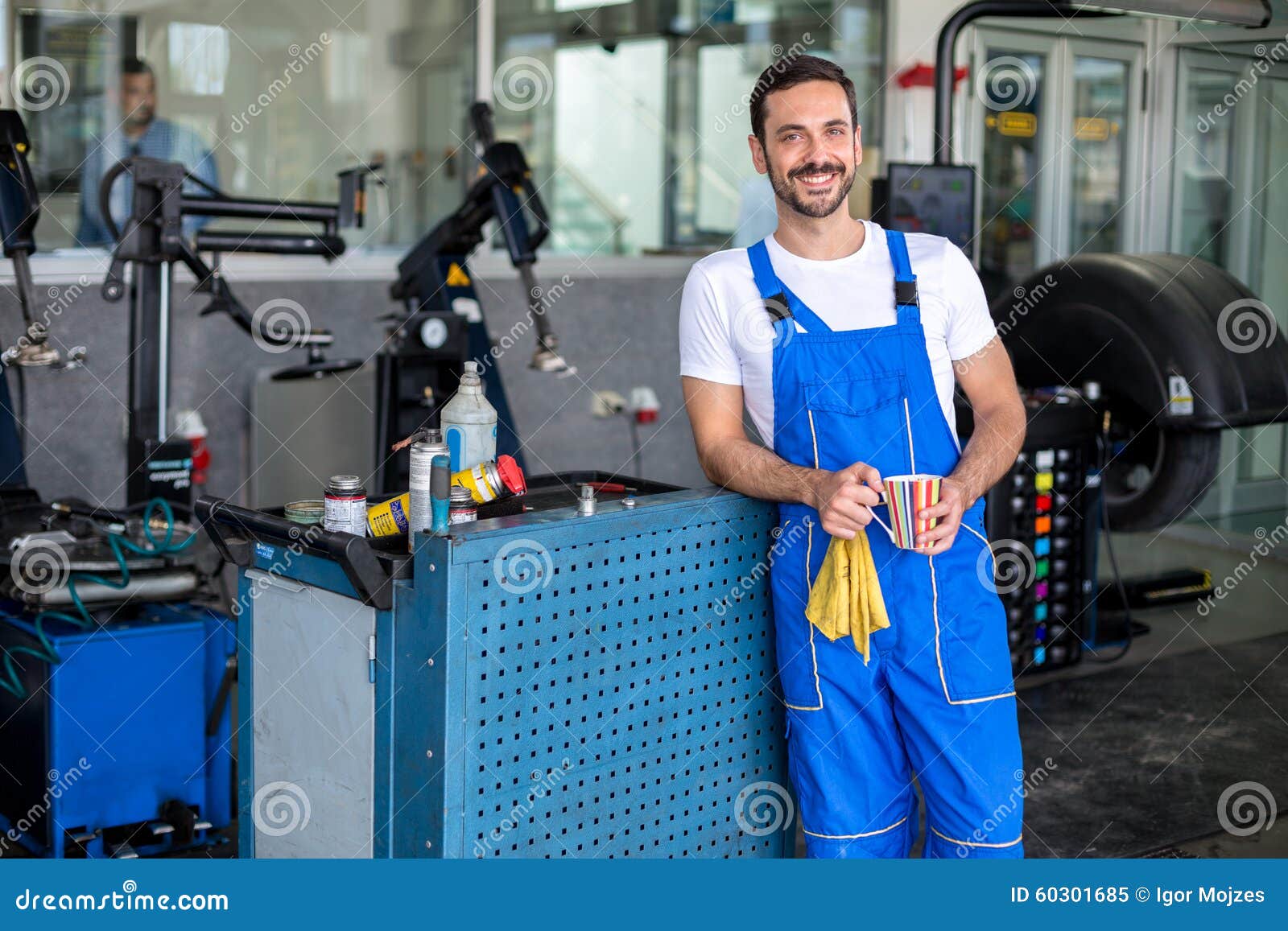 A Male Engineer Looks At The Floor Plan At The Construction Site Stock ...