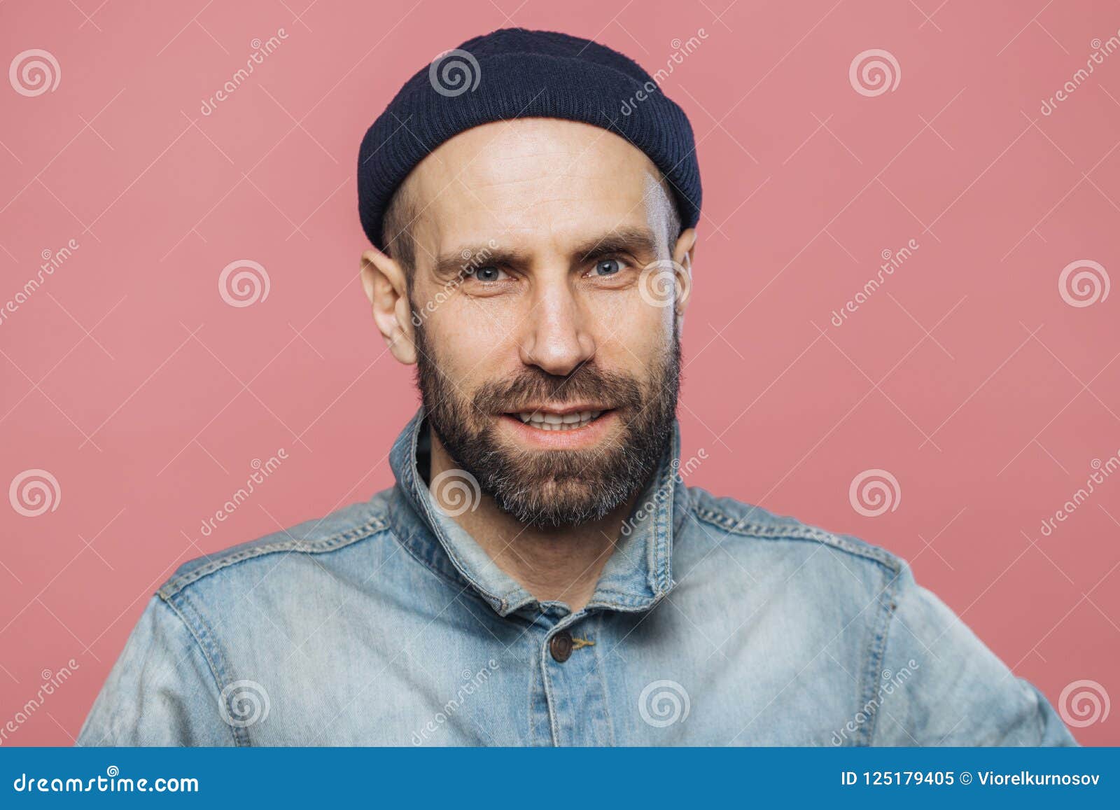 Satisfied Male Model With Thick Beard And Mustache Looks With Confident