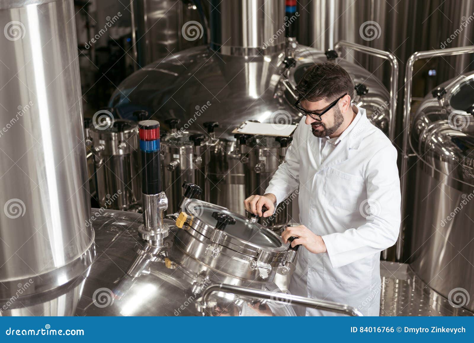 Satisfied Man Using Brewing Mechanism at Factory Stock Photo - Image of ...