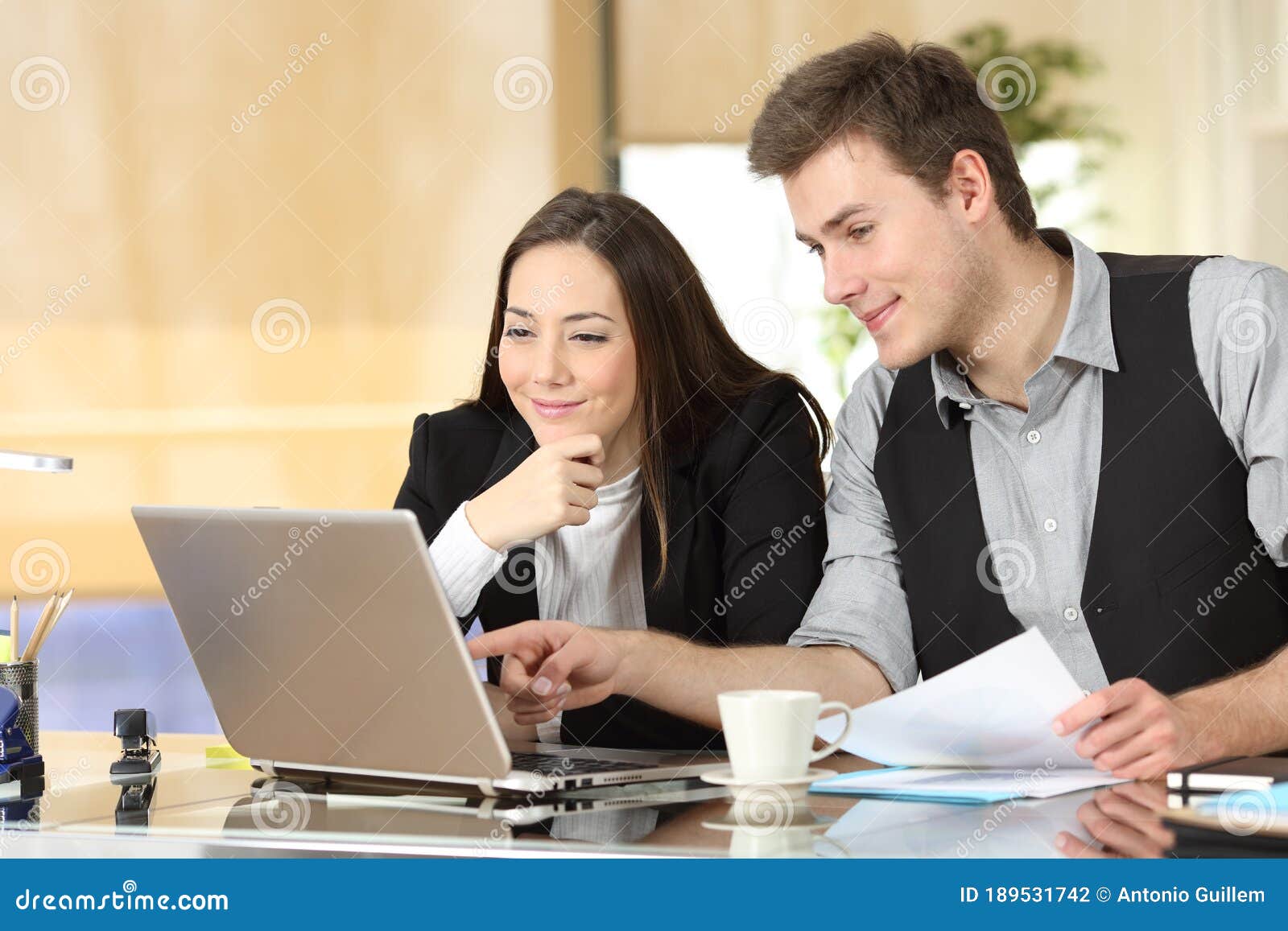 Satisfied Office Workers Checking Laptop Content Stock Photo - Image of ...