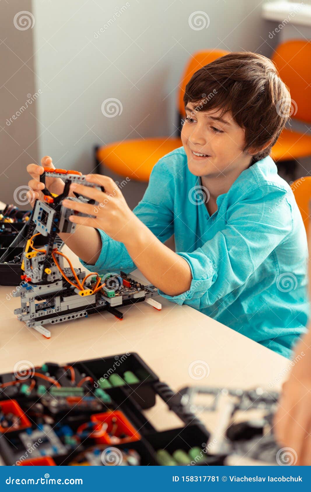 Cheerful Boy Playing with the Robot he Built. Stock Image - Image of ...