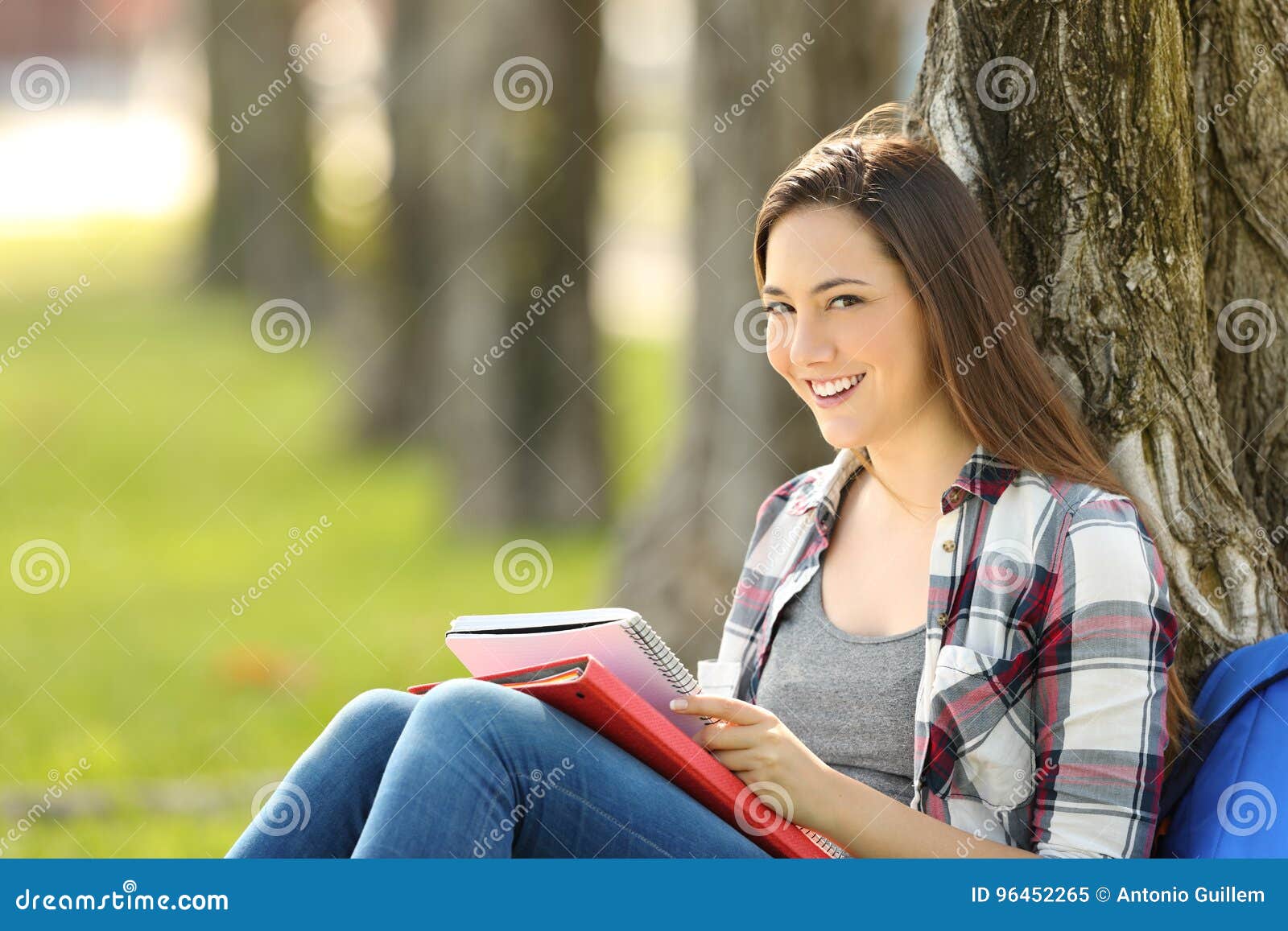 Satisfied Student Posing Looking at You Stock Image - Image of camera ...