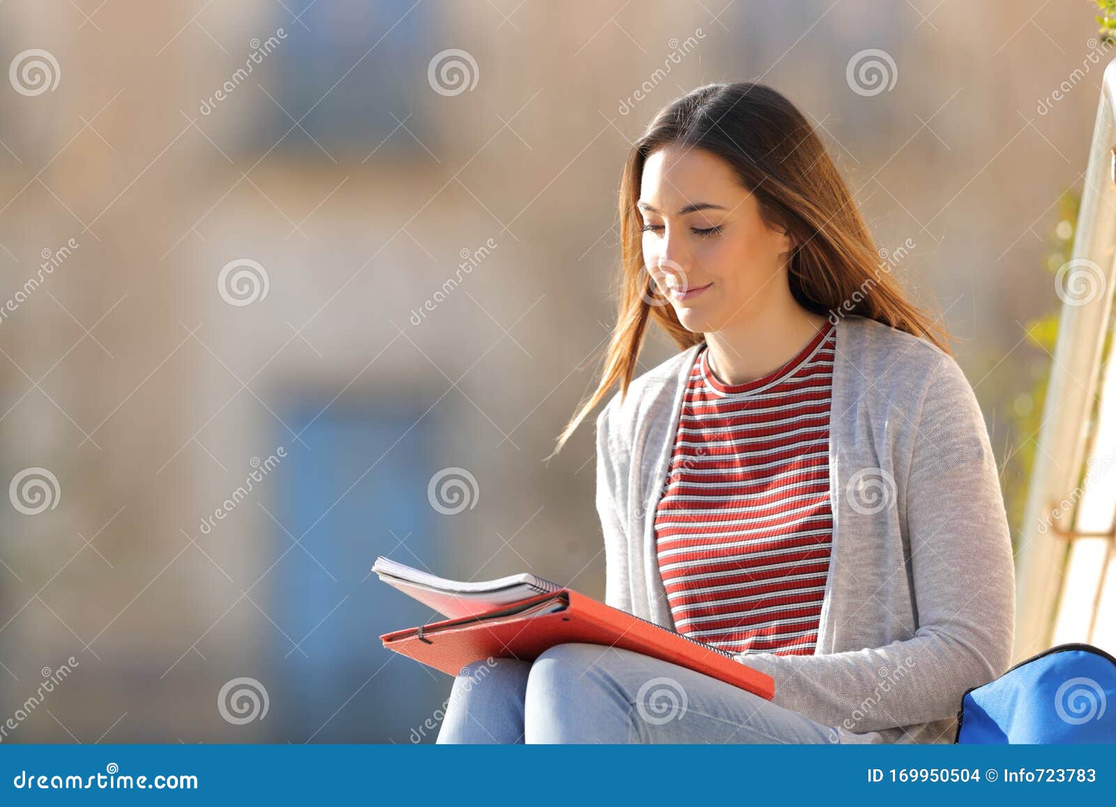 Satisfied Student Studying Reading Notes Sitting in a Campus Stock ...