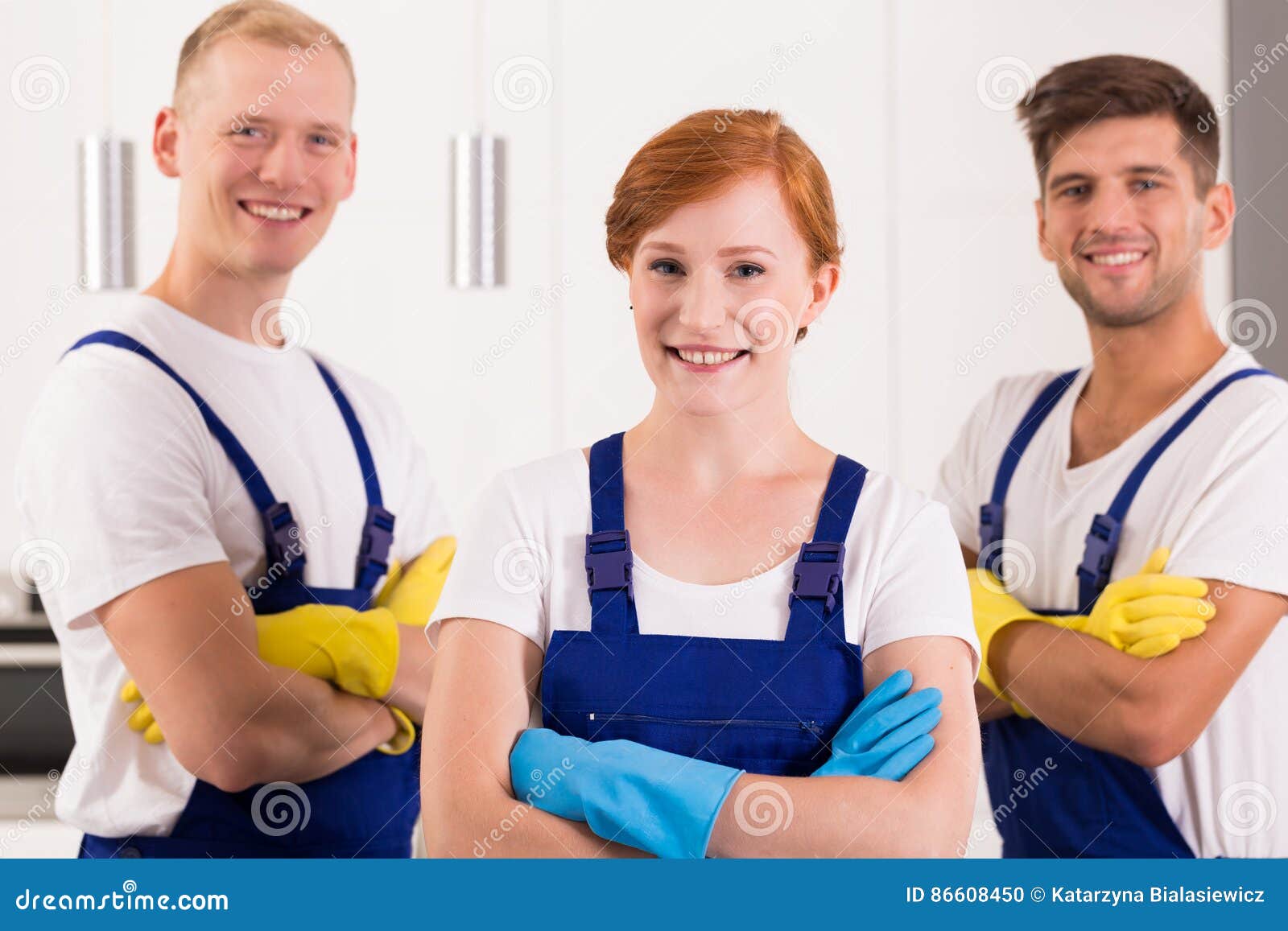 Satisfied team of cleaners stock photo. Image of interior - 86608450