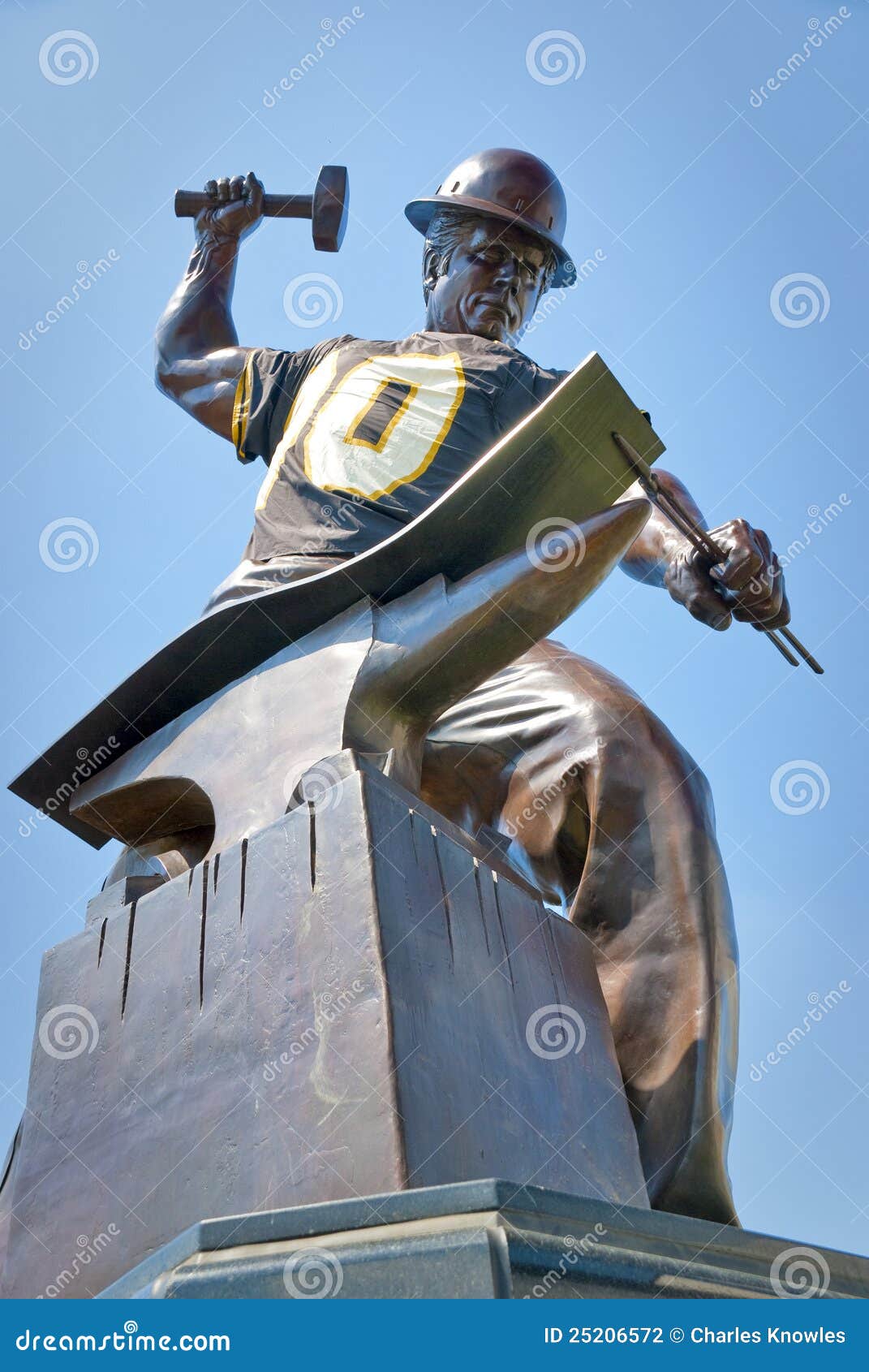 Satue of a Steel Worker Against a Blue Sky Stock Photo - Image of blue ...