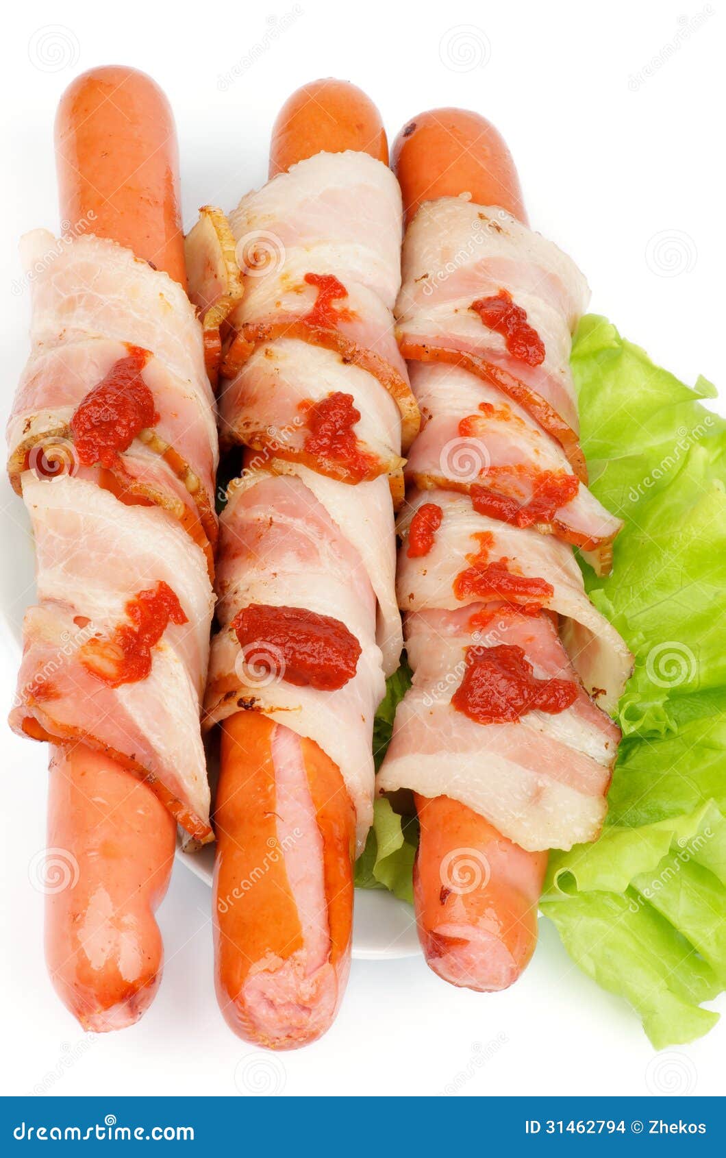 Saucisses Enveloppées En Lard Photo stock - Image du tomate, grillé ...