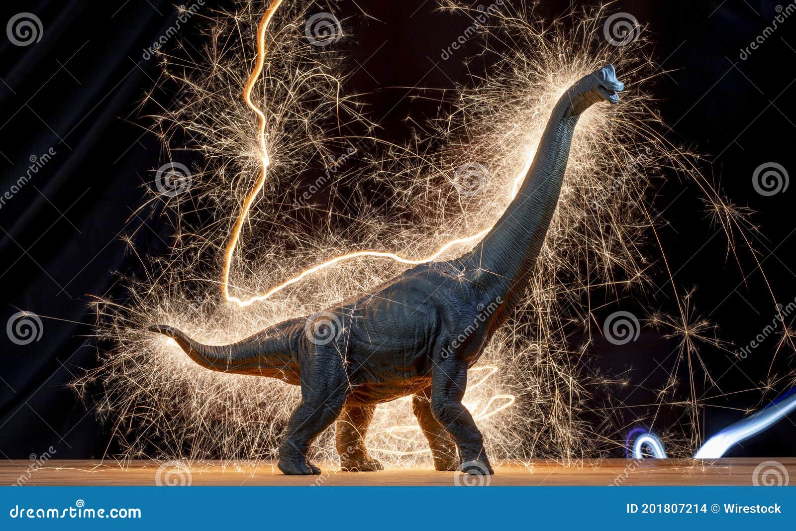 Sauropod Dinosaur Rubber Figurine Shining in Firework Sparkle Standing ...