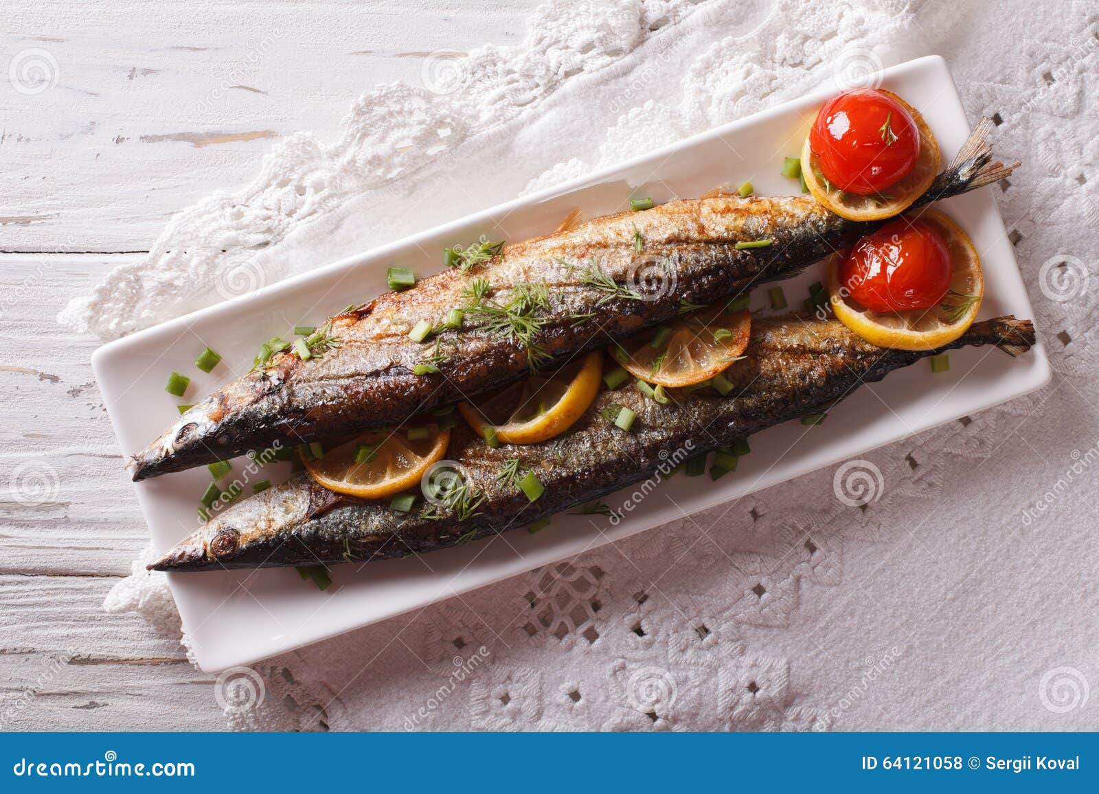 Saury Grilled with Vegetables on a Plate Close-up. Horizontal To Stock ...