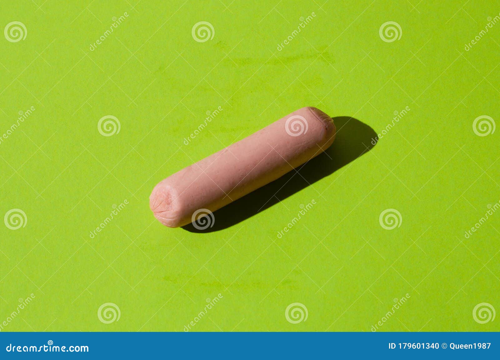 Sausage on a Bright Green Background with Hard Light Stock Photo ...