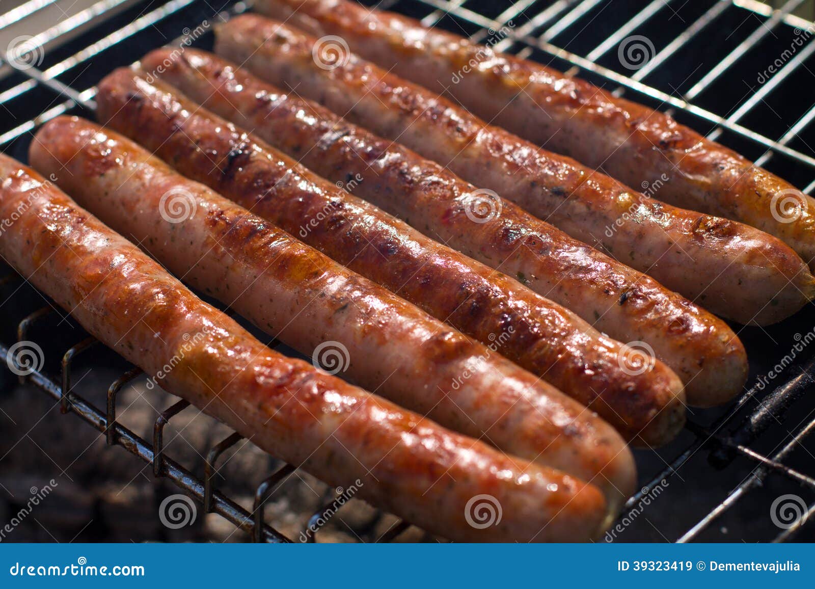 Sausages on grill stock image. Image of burn, grill, cooked - 39323419