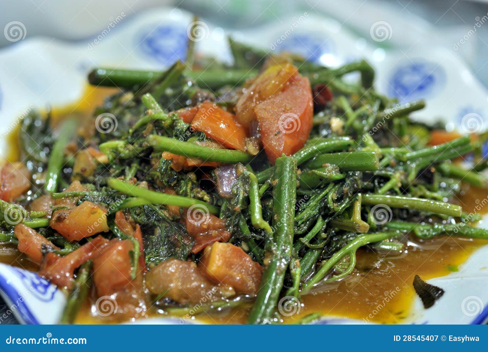 Saute Fern Shoot with Tomato Stock Image - Image of chinese, vegetable ...