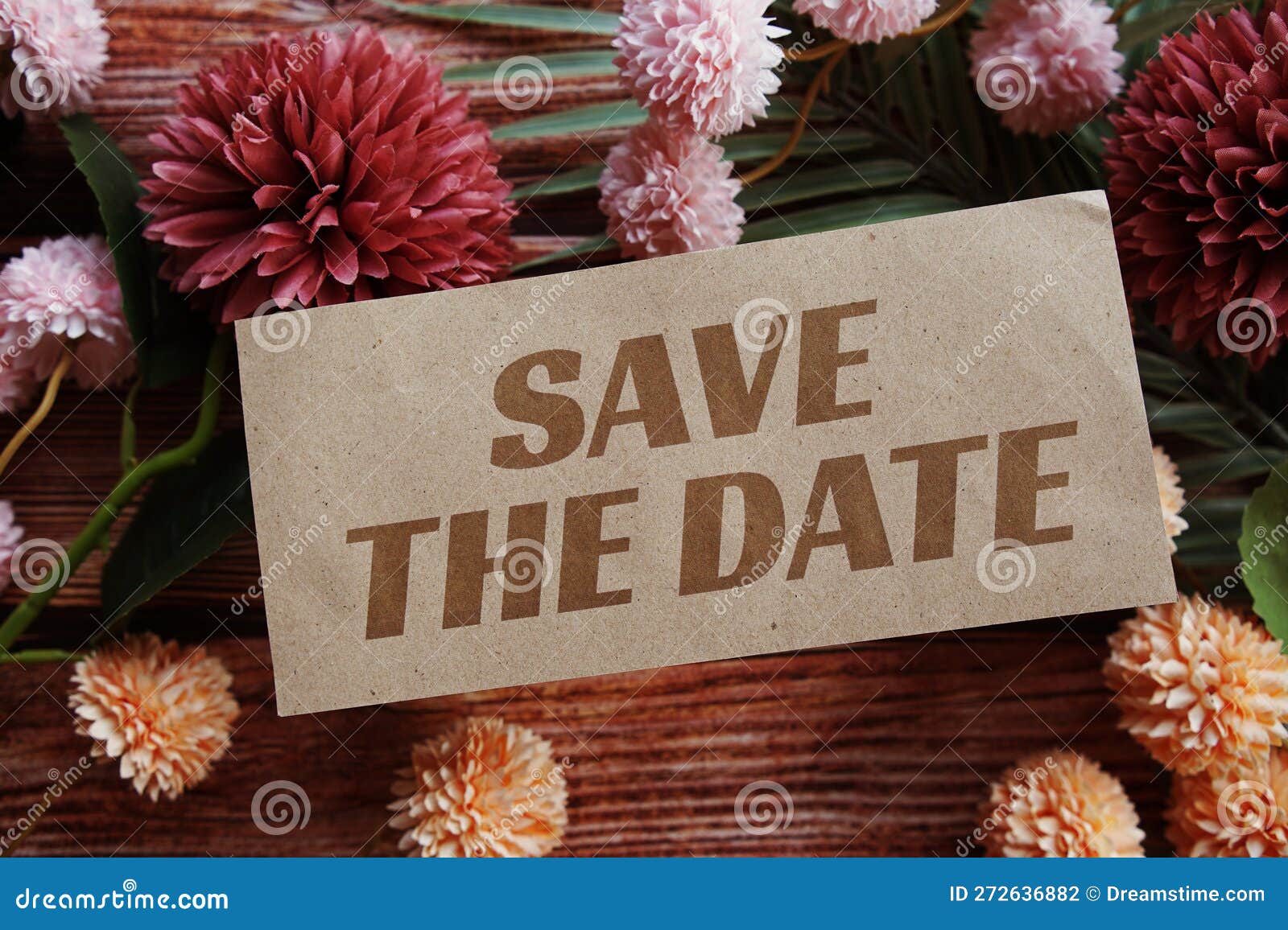 Save the Date Text Message with Flower Decoration on Wooden Background ...