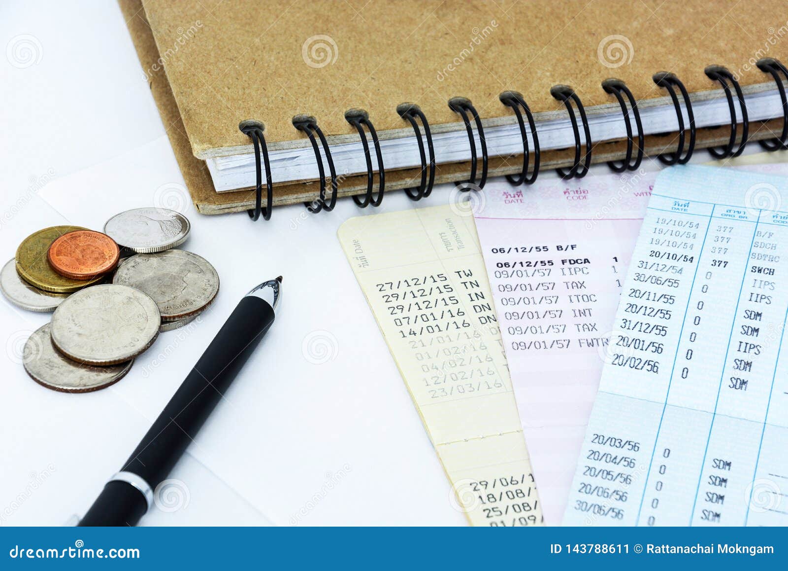 Saving Account Passbooks and Coins with Pen and Notebook on White ...
