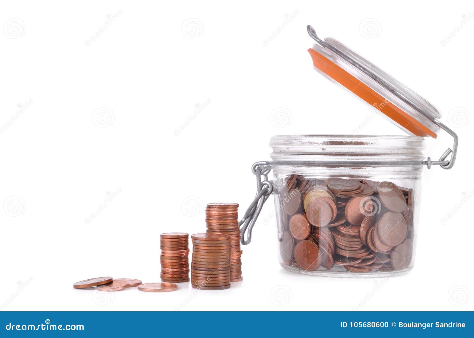 Saving coins in a jar stock photo. Image of pile, wealth - 105680600