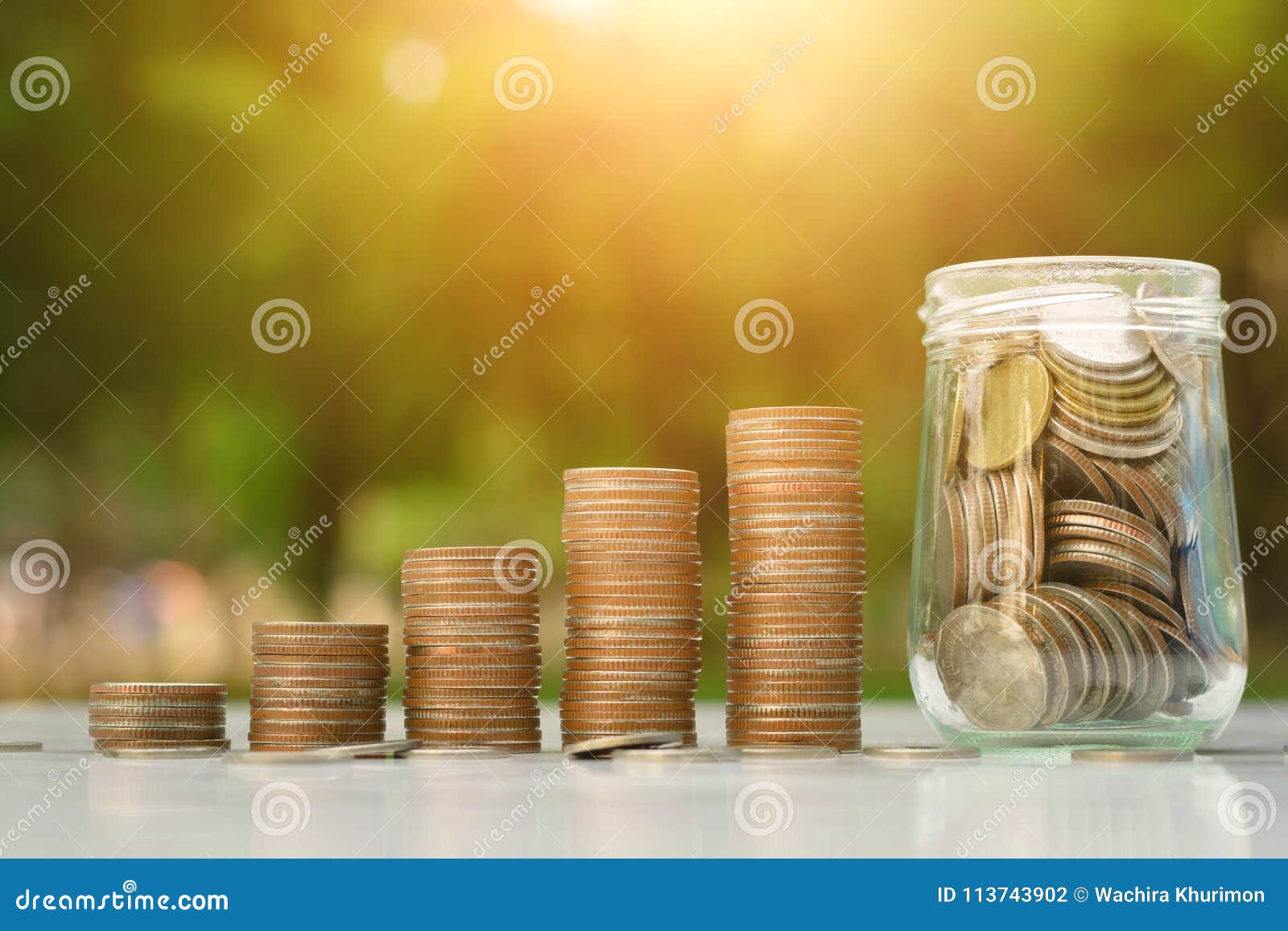 Saving Money Concept with Coin Stack Growing and Bottle Business on ...