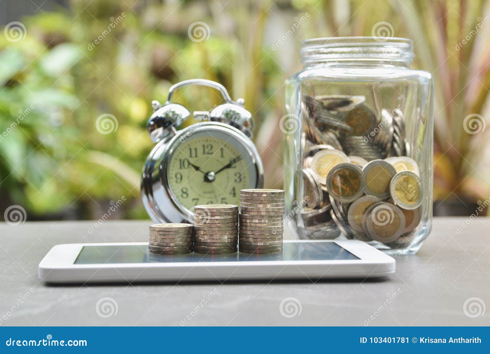 Saving Money Concept with Money Coin Stack on Smart-phone Stock Image ...