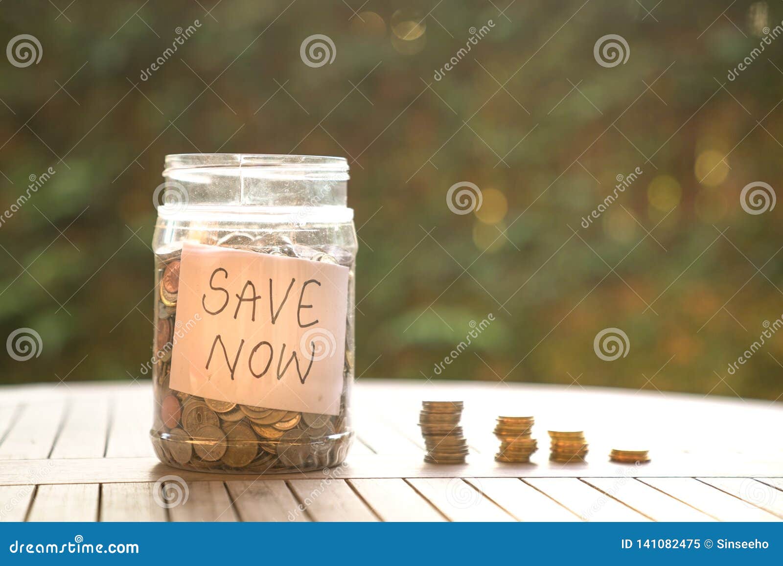 Saving Money Concept : Coins in Container and Stacked on Table Stock ... Saving Money Concept : Coins in Container and Stacked on Table Stock ...