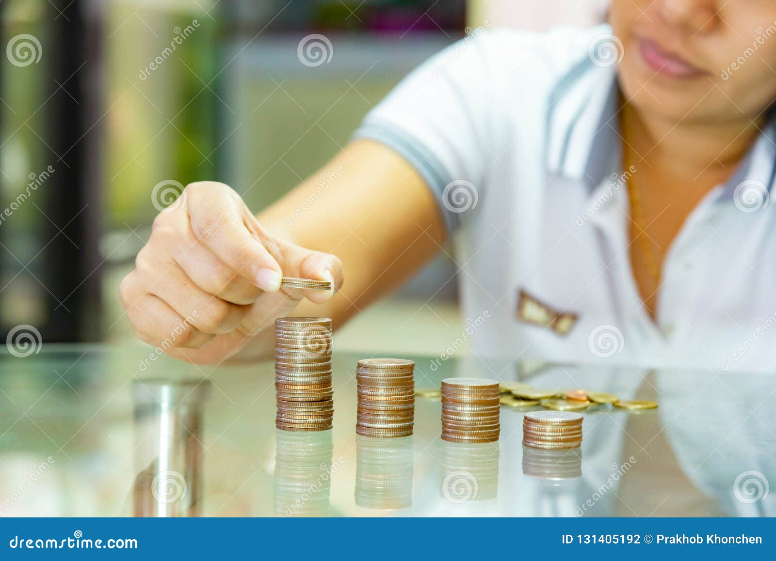 Saving Money Concept, Woman Stacking Coins into Increasing Stack ...