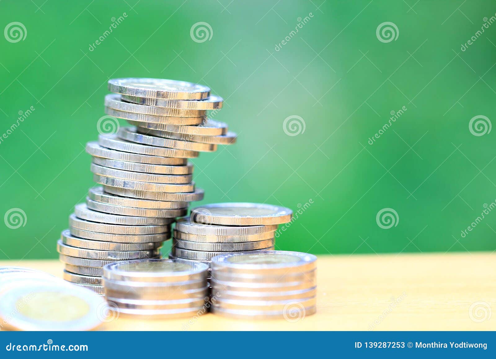 Saving Money, Stack of Coins Money on Natural Green Background Stock ...