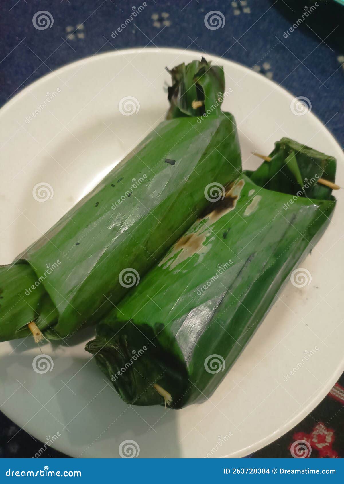 Savory Roasted Rice Wrapped in Banana Leaves Stock Photo - Image of ...