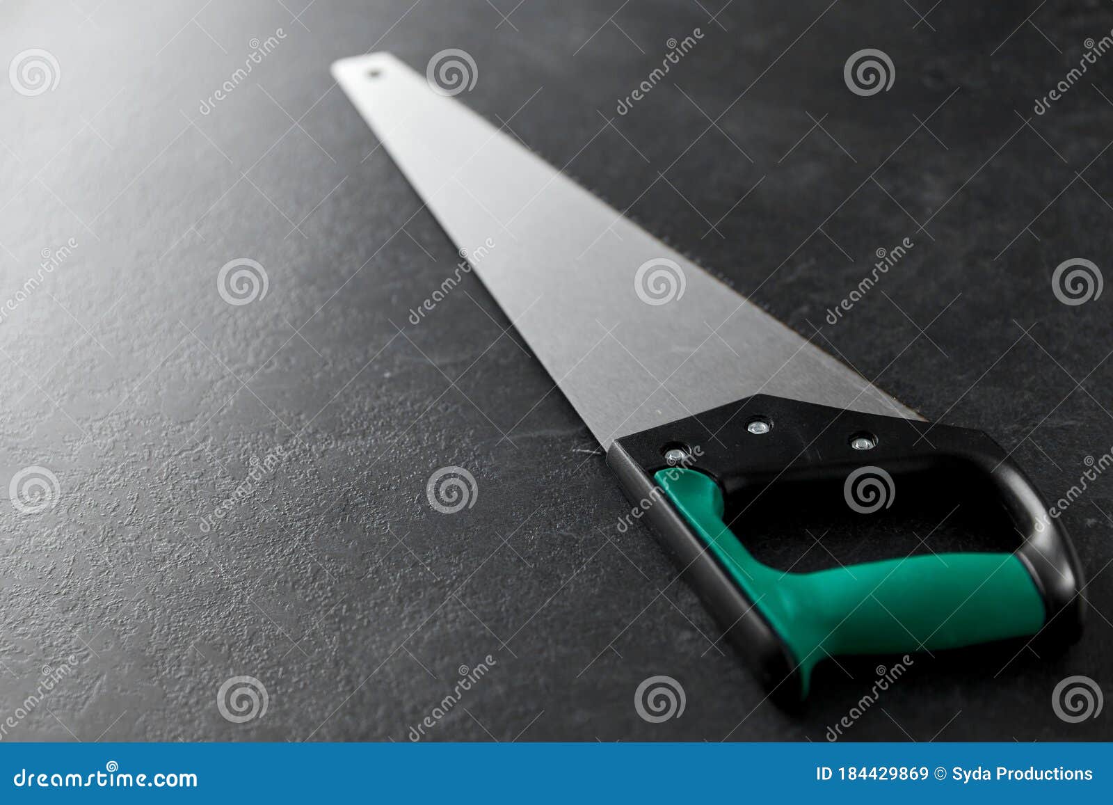 Saw on slate background stock image. Image of armsaw - 184429869