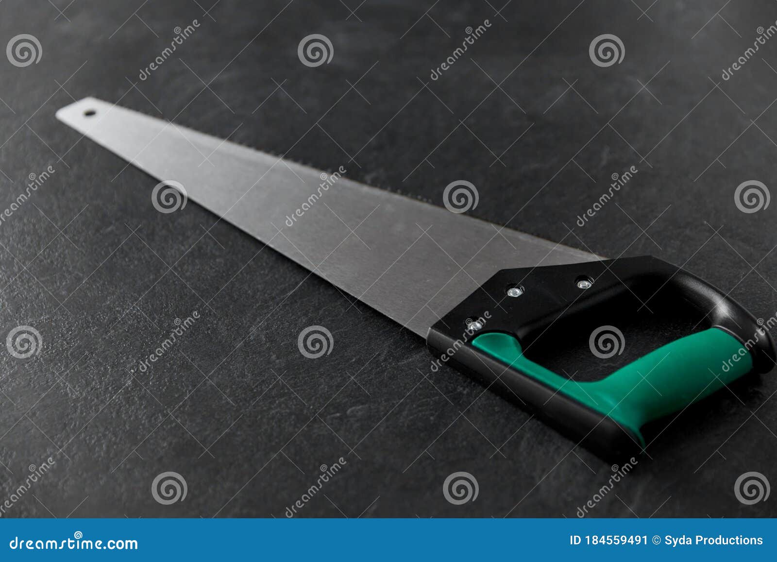 Saw on slate background stock image. Image of stone - 184559491