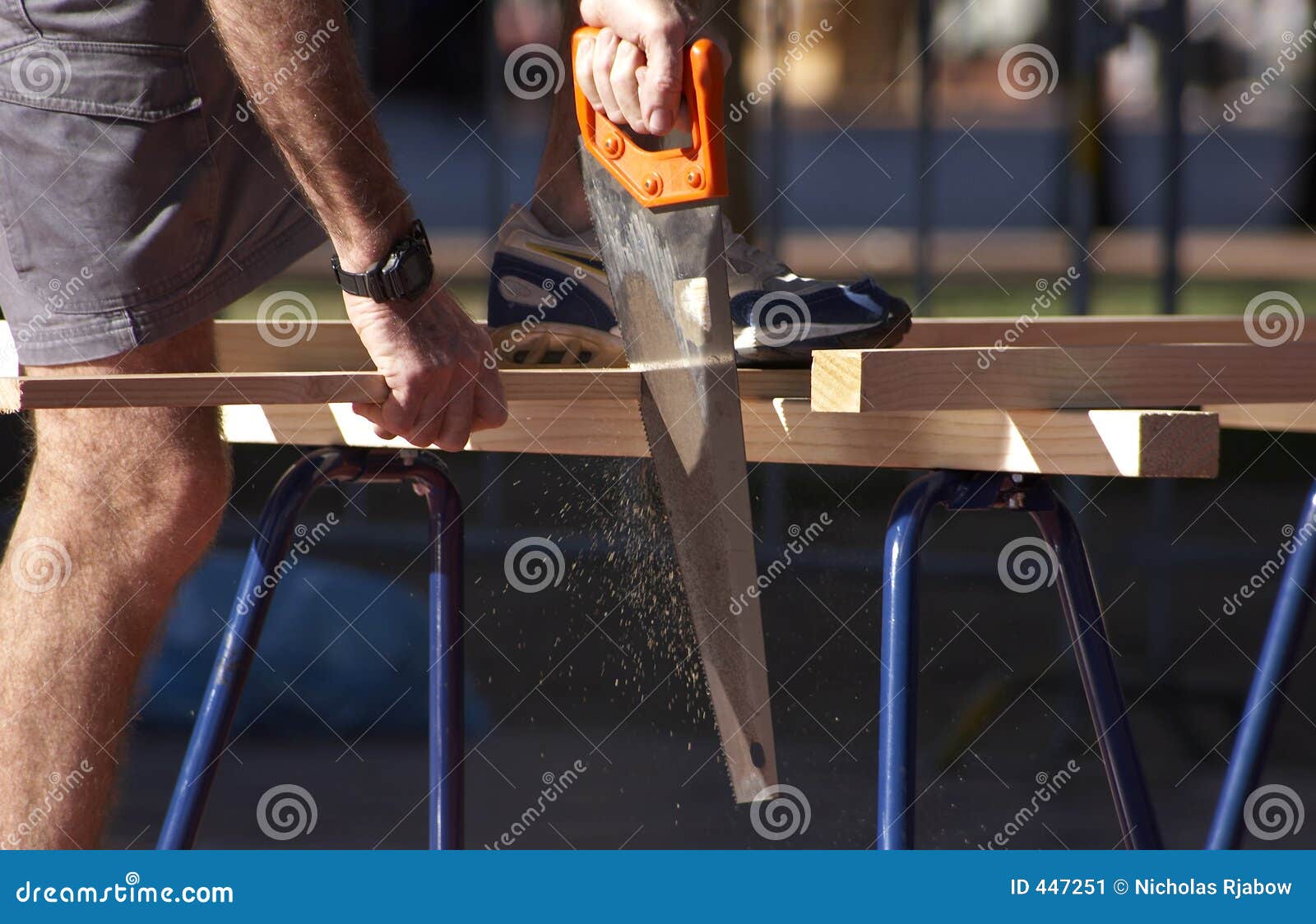 Sawing Wood stock image. Image of shorts, worker, shoe - 447251