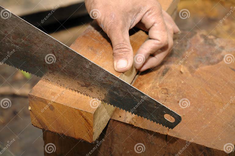 Sawing a wood stock image. Image of sawing, woodworking - 8232227