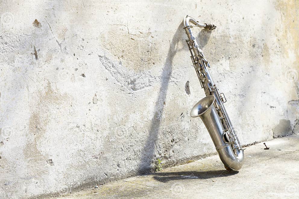 Sax in Front of a Vintage Wall Stock Image - Image of floor, instrument ...
