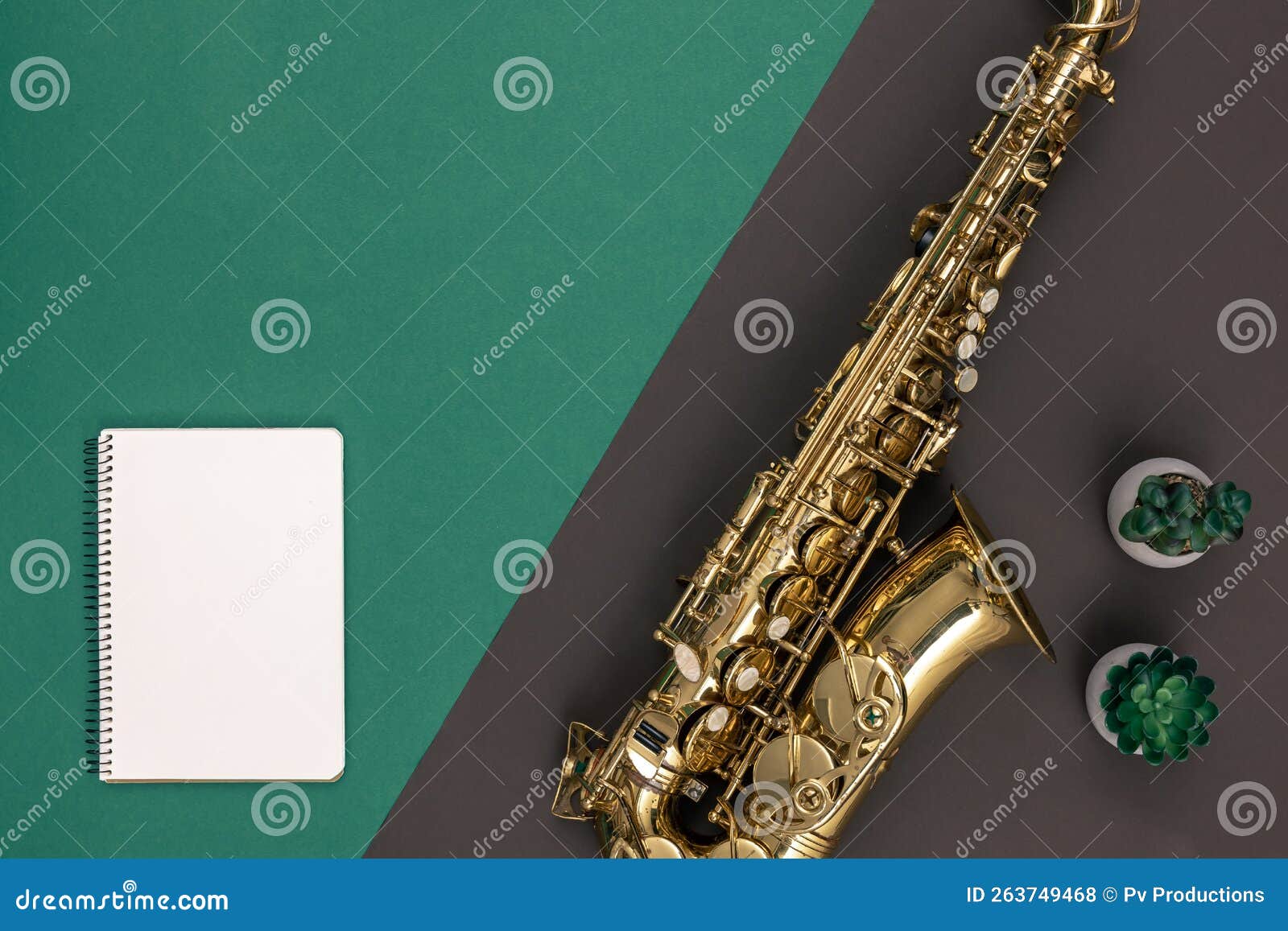 Saxophone on a Green Background and Notepad, Top View. Stock Photo ...