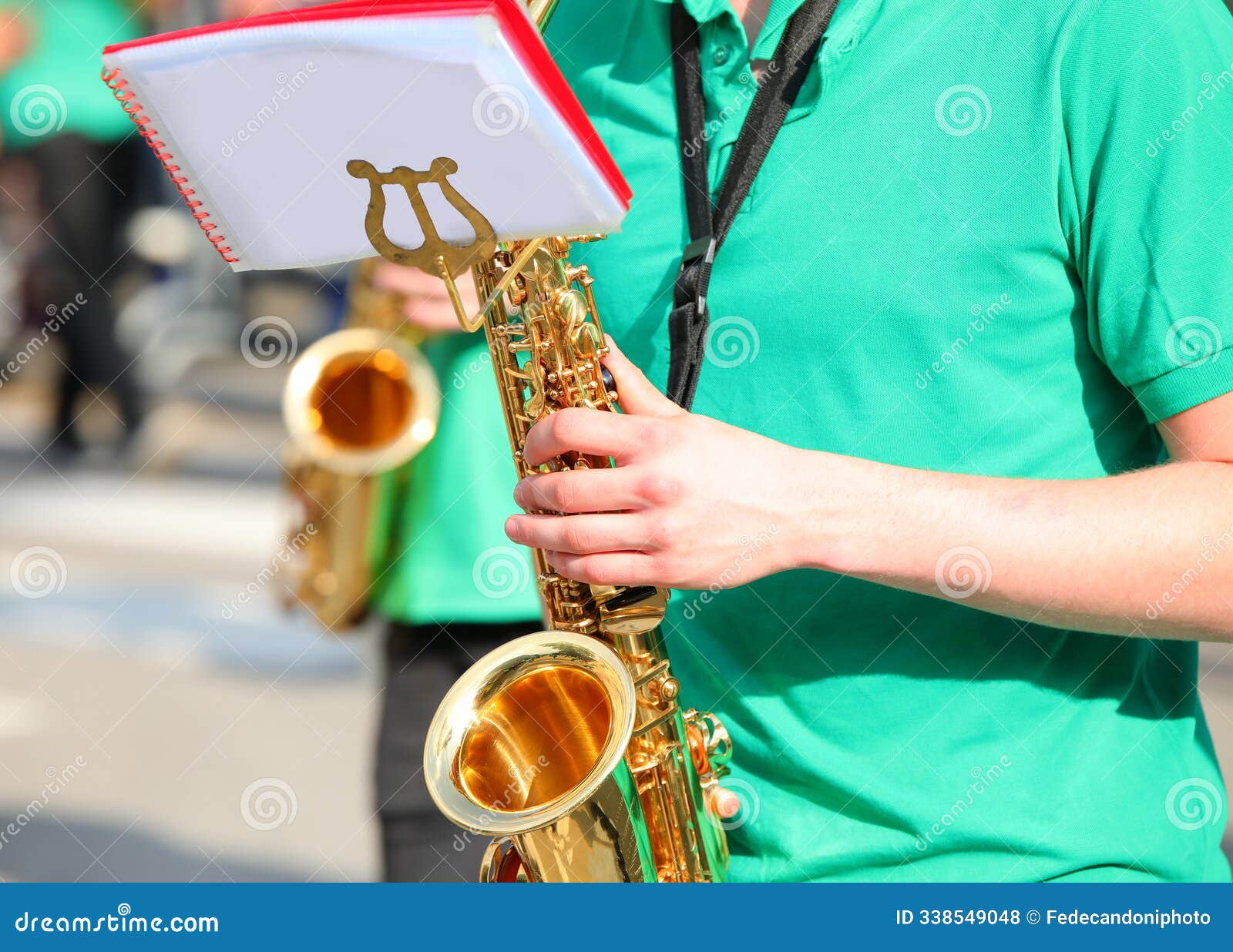 Saxophone Player in the Marching Band Performs during the City Parade ...