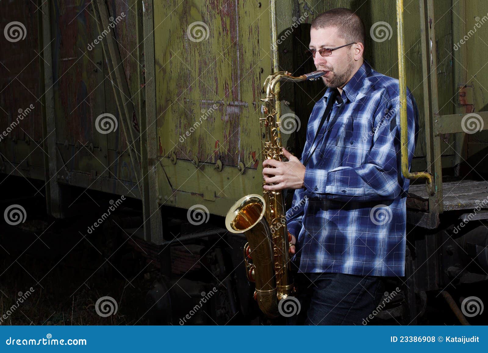 Saxophone player outdoors stock photo. Image of gold - 23386908