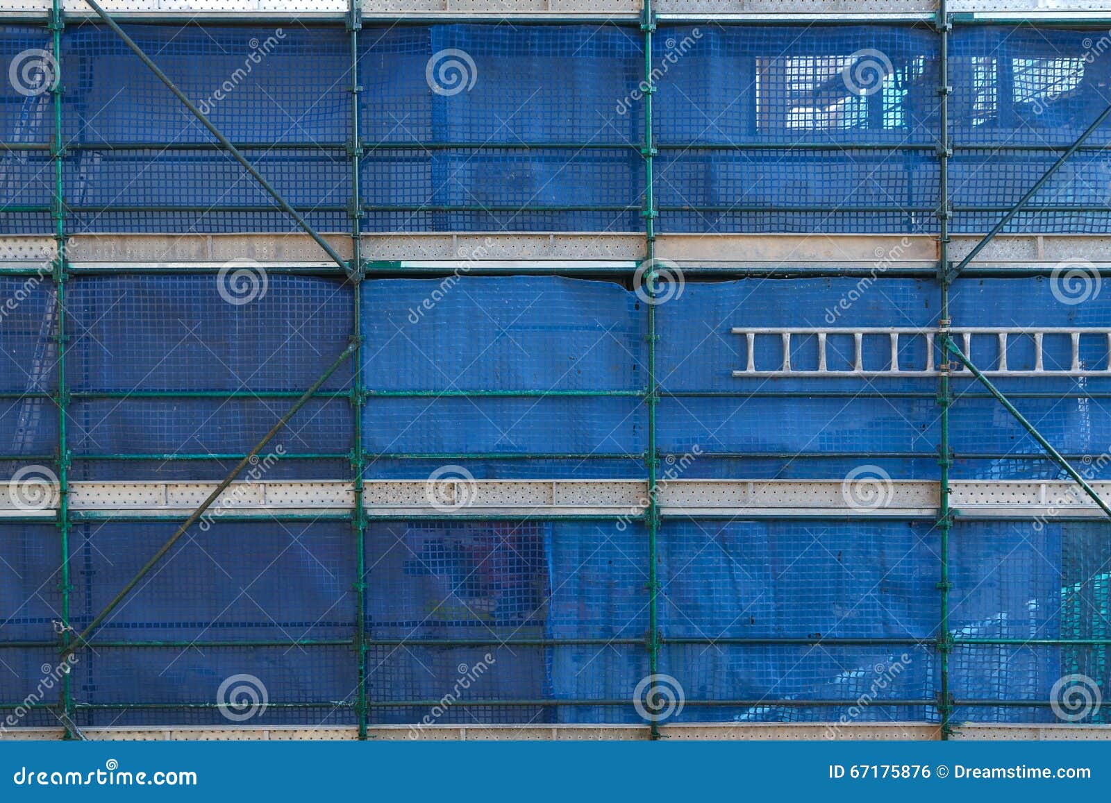 Scaffold and Blue Hoardings with Ladder on Construction Site Stock ...