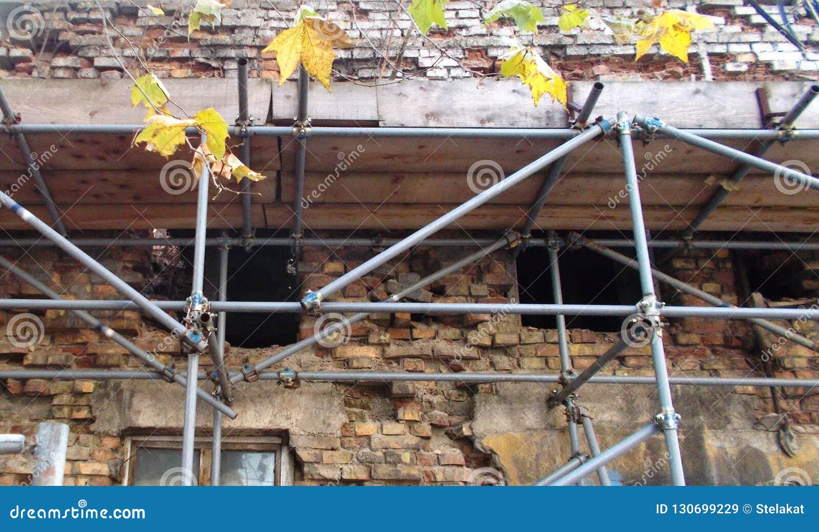 Scaffold on old building stock image. Image of house - 130699229