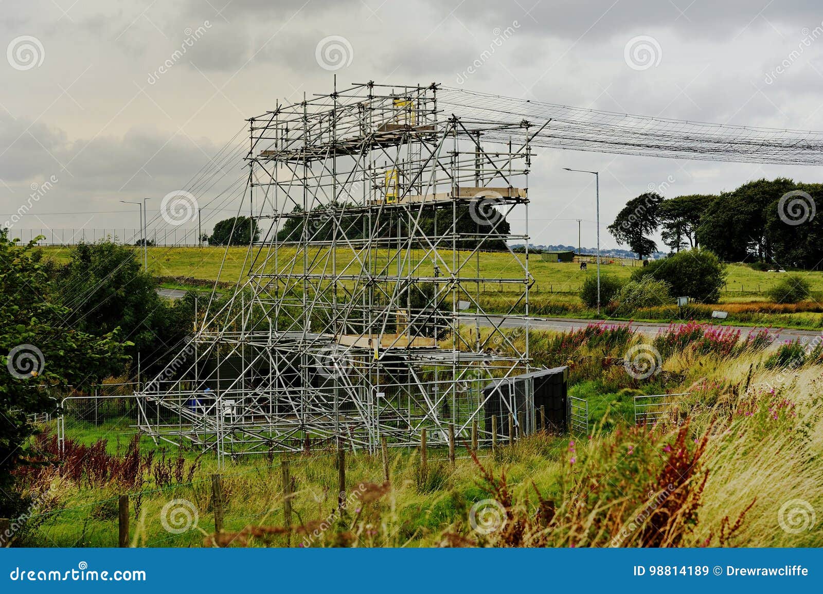 Scaffold tower in a field stock image. Image of cables - 98814189