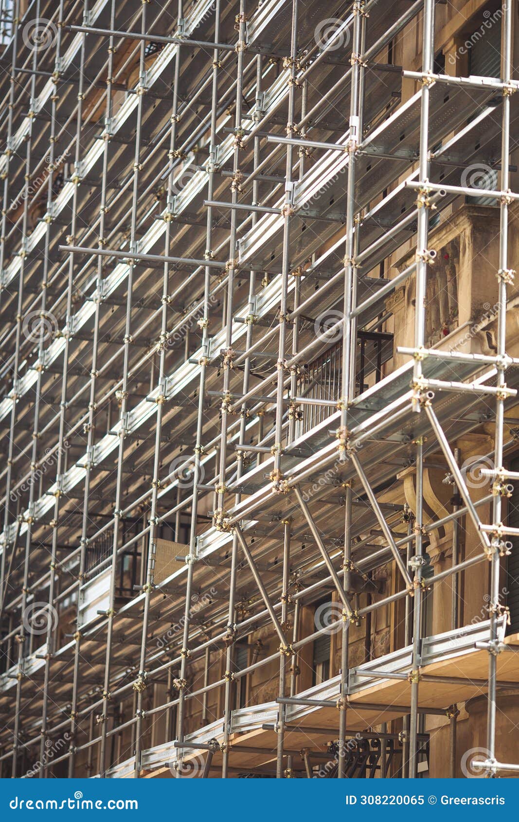 A Scaffolding Construction Pattern Against a Building in Italy ...