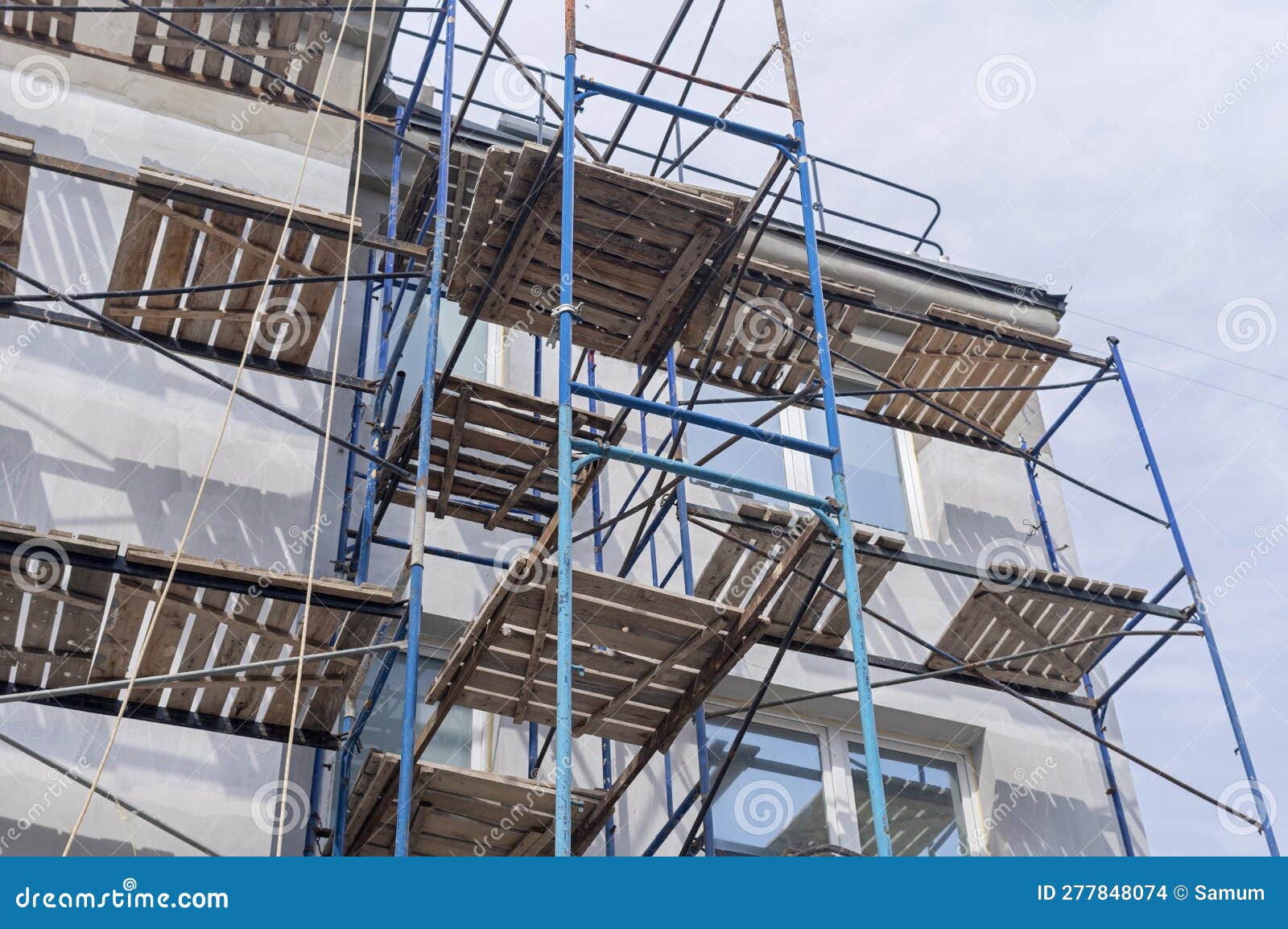 Scaffolding on the Facade of a House Under Construction Stock Photo ...