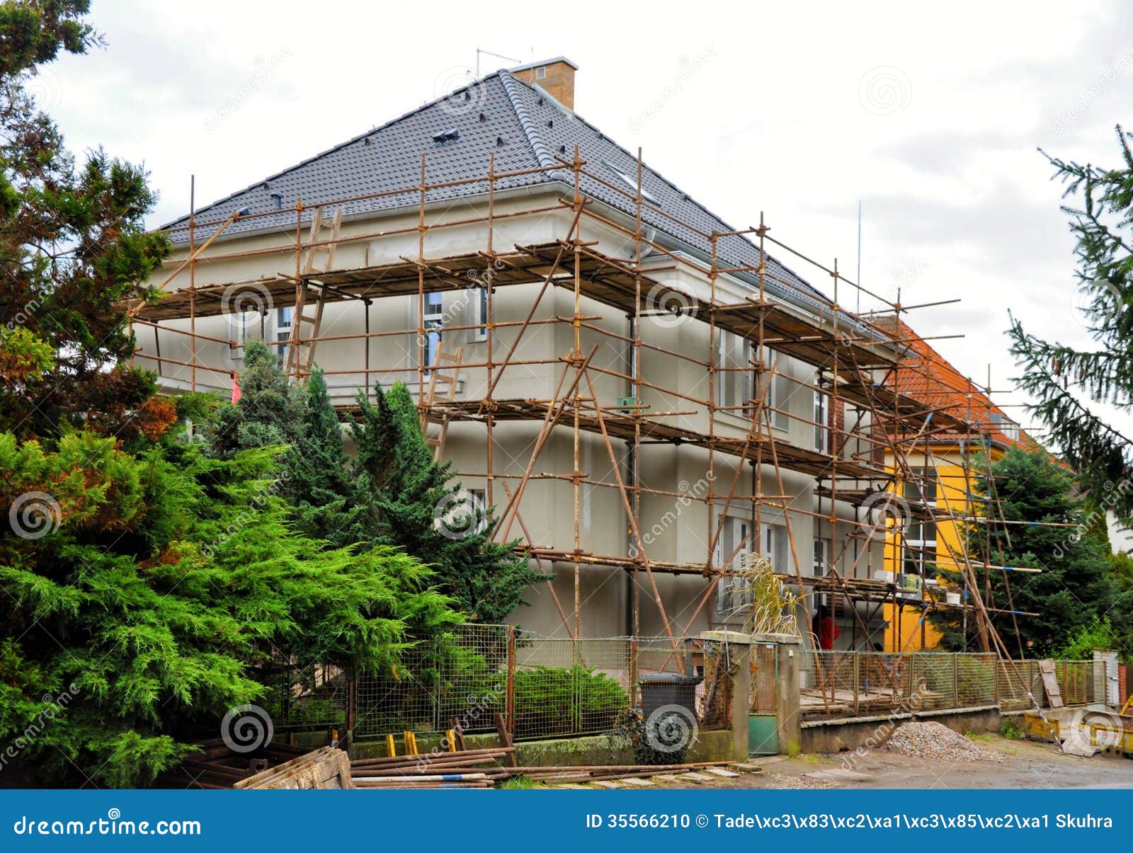 Scaffolding on the house stock photo. Image of blue, houses - 35566210
