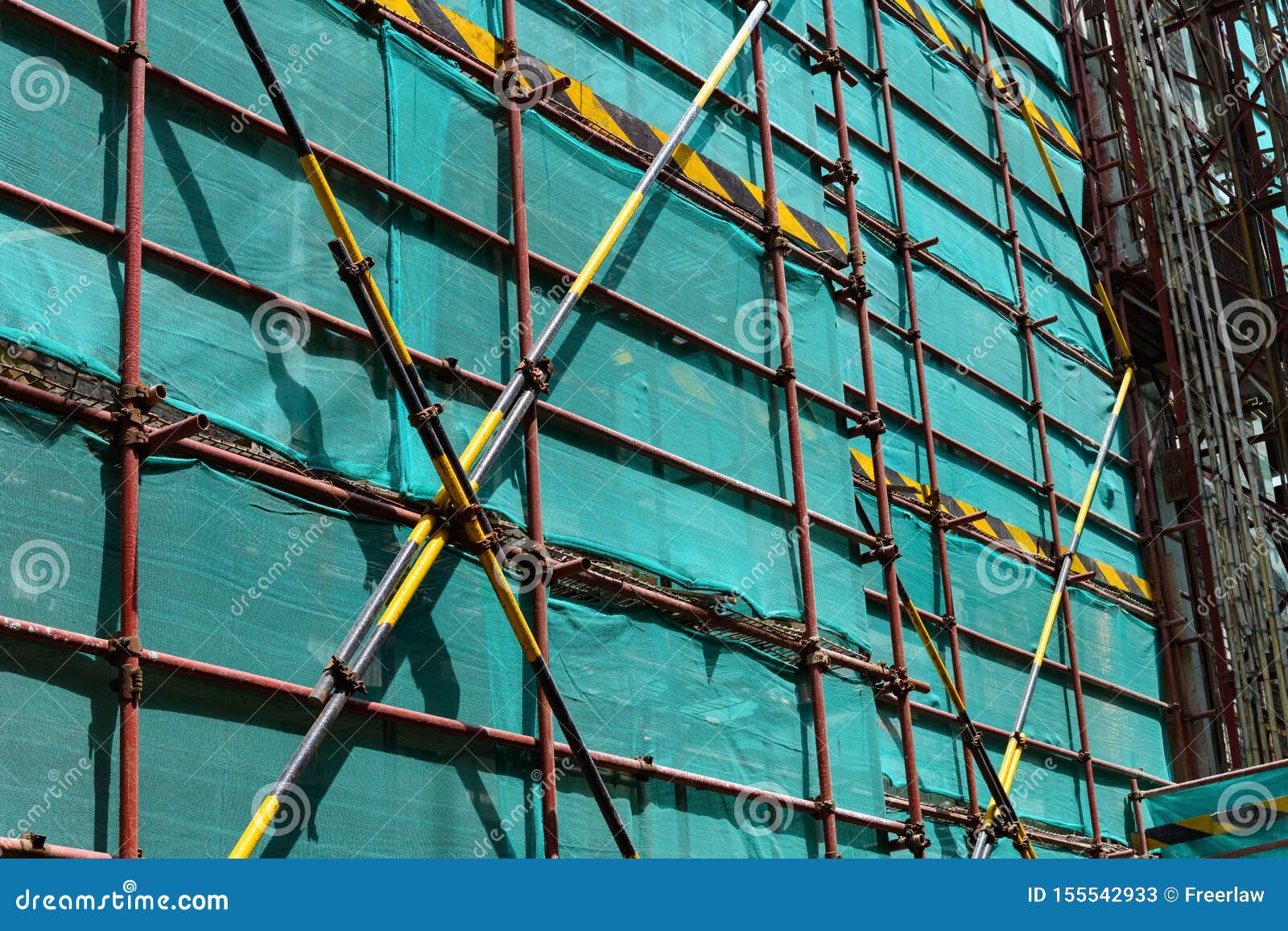 Scaffolding & Protection Netting on an Unfinished Building Stock Image ...