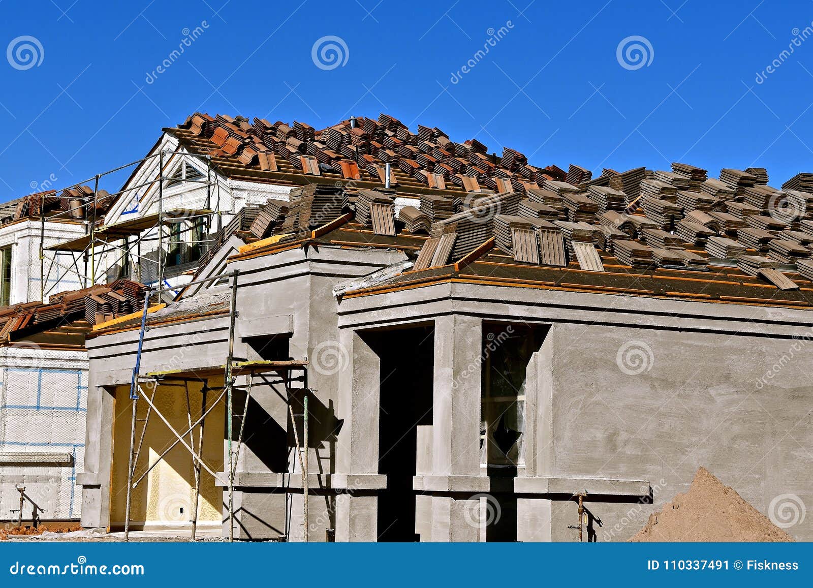 Scaffolding and Shingles of a New Building Under Construction Stock ...